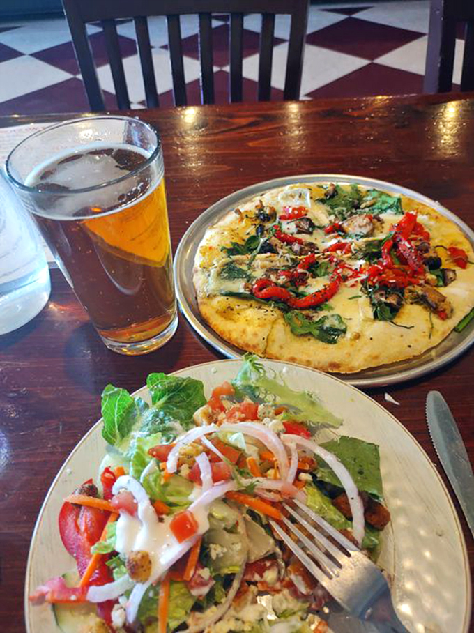 Pizza, salad, and beer: the holy trinity of pub grub. This plate is like a balanced diet for the soul. Photo credit: Photo credit: Marion Oswald