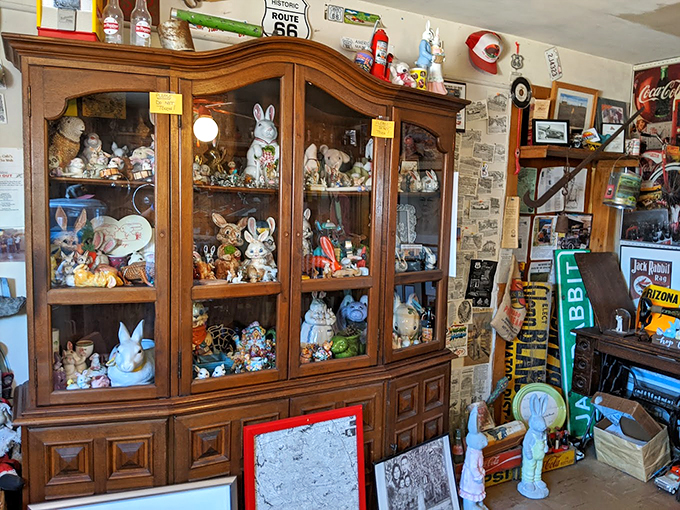 A curated collection of rabbit figurines fills antique cabinets, telling the whimsical story of this Route 66 landmark.