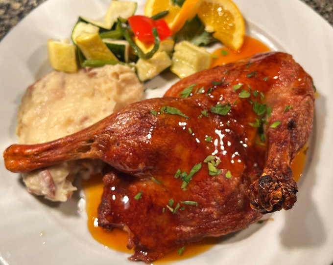 This duck, glazed to golden perfection, proves that seafood isn't the only star in this kitchen's repertoire.