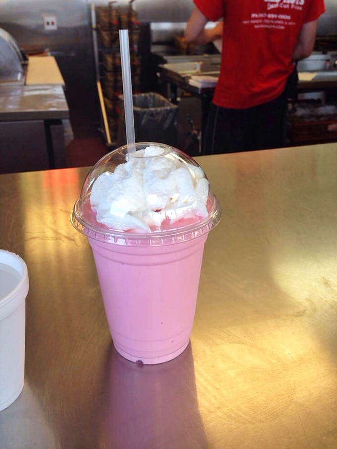 Pink perfection in a cup, topped with a cloud of whipped cream - because sometimes happiness comes with a straw.