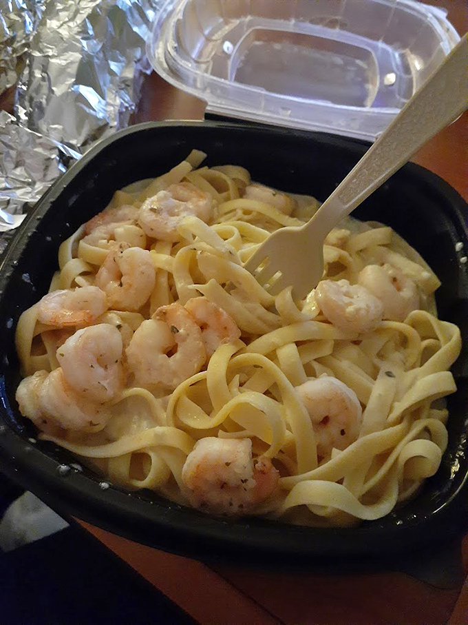 Plump shrimp nestled in perfectly cooked fettuccine - seafood and pasta having their best day ever.