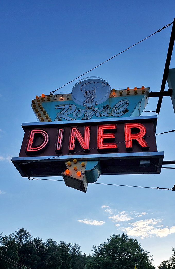 As the sun sets, the Chelsea Royal sign lights up like a beacon of hope for weary travelers and hungry locals alike.