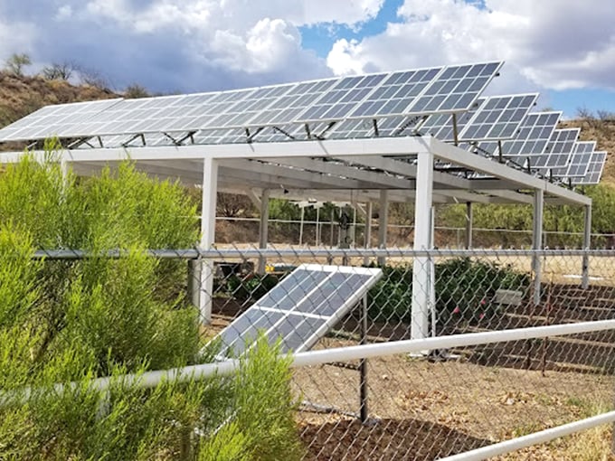Solar panels harness Arizona's abundant sunshine, powering this ambitious experiment in environmental science.
