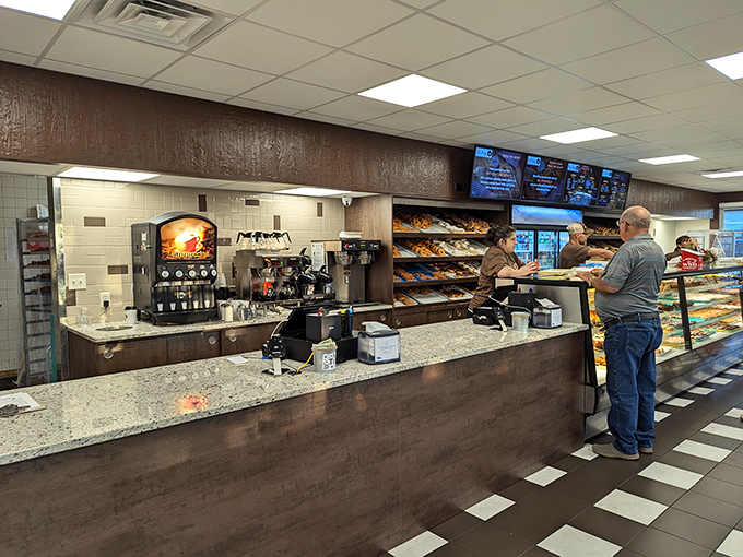 Behind the counter: where donut dreams come true. These folks are the Willy Wonkas of the pastry world!