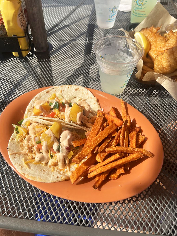 Fresh fish tacos dressed up with mango salsa - like a tropical vacation wrapped in a warm tortilla.