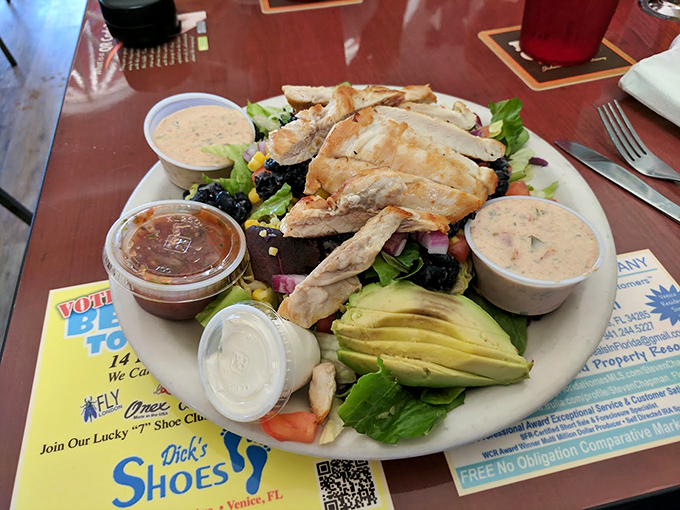 Chicken salad dreams are made of this! Nestled on a bed of greens, it's like a picnic decided to get all fancy on us. Photo credit: Dan Berends