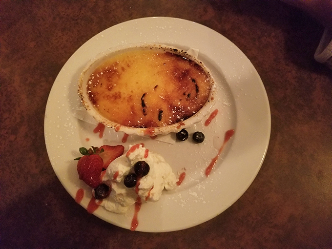 Crack into happiness! This cr&egrave;me br&ucirc;l&eacute;e's top is caramelized to perfection, waiting for your spoon to start a delicious treasure hunt. Photo credit: Ismael Nieves