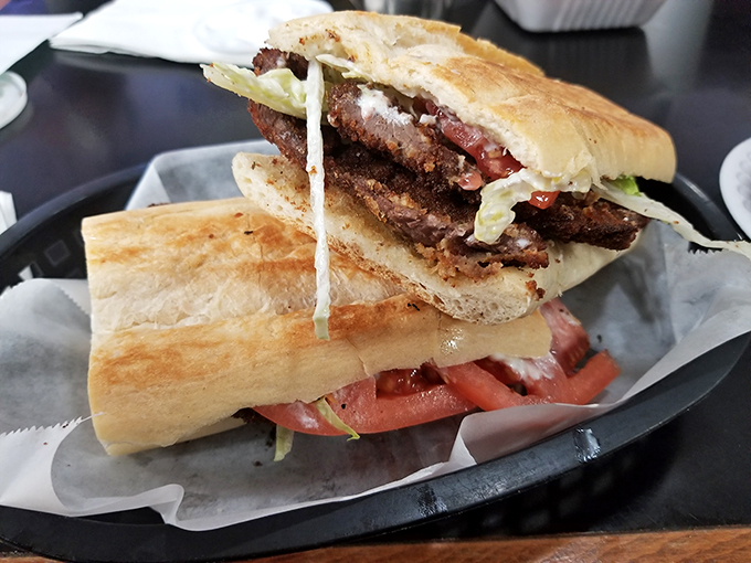 This isn't just a sandwich, it's an edible work of art. Layer upon layer of Cuban-inspired deliciousness. Photo credit: Manolo Hernandez