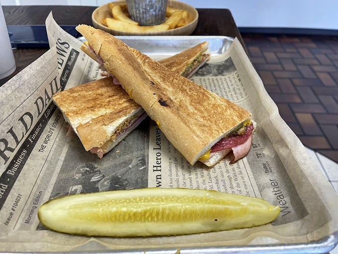 The Cuban sandwich, deconstructed. Layers of flavor stacked higher than your grandkid's Lego tower, all on a newspaper canvas. Photo credit: Shawn L.