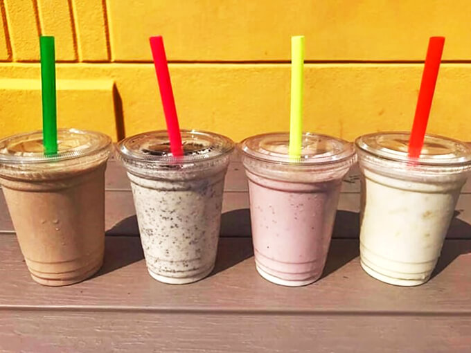 Cool, creamy shakes in every flavor, lined up like a dairy rainbow ready to battle Chicago summer heat.