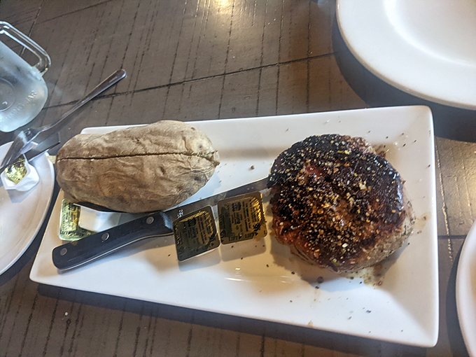 A perfectly seasoned steak with a baked potato companion - sometimes the classics are classic for a reason.