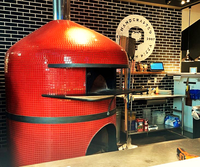 That red-tiled pizza oven isn't just kitchen equipment, it's the beating heart of Klavon's pizza paradise.