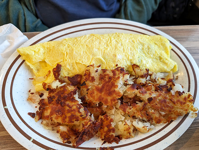 This omelet is a golden sunrise on a plate. Packed with more goodies than Santa's sleigh, it's the breakfast of champions.
