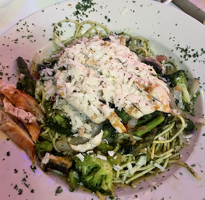 Pasta la vista, baby! This dish is a carb lover's dream, topped with enough grilled chicken to make a gym trainer proud.