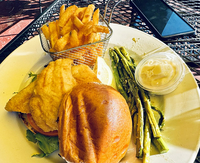 Another angle of perfection: golden-fried perch on a pillowy bun, proving that sometimes the simplest things are the most extraordinary.