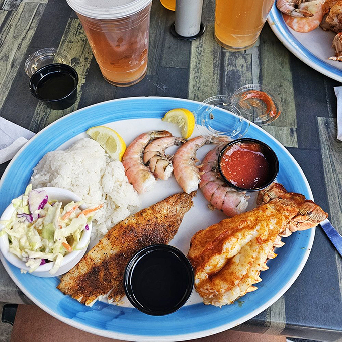 The ocean called, it wants its buffet back! This plate is a seafood lover's dream come true, from succulent shrimp to perfectly grilled fish.
