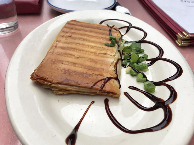 Flaky, golden, and oh-so-tempting! This spanakopita is proof that sometimes the best things in life are wrapped in phyllo dough. Photo credit: Nina E.