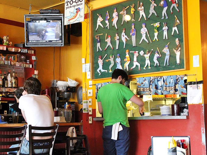 Where the magic happens! The staff works their wiener wizardry behind the counter, conjuring up hot dog delights that would make Houdini jealous.