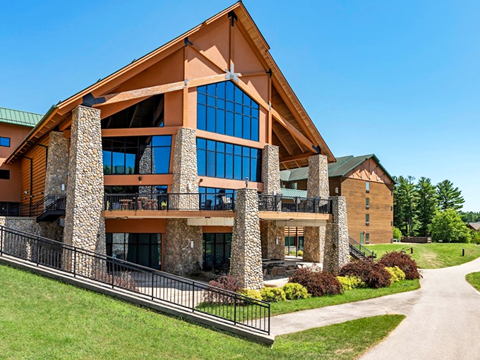 Lodge-style architecture and stone columns create a grand entrance to this northwoods-themed water paradise.