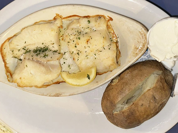 Flaky haddock that practically sparkles under its herb-flecked coating. Simple perfection needs no fancy frills. Photo credit: Susan B.