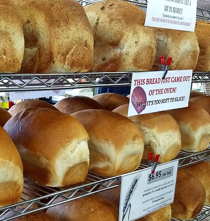 Fresh-baked loaves lined up like soldiers, ready to march straight into your heart (and shopping bag).