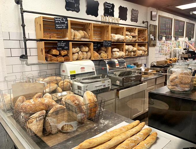 A bread display that would make any European baker proud, with crusty loaves lined up like soldiers ready for sandwich duty.