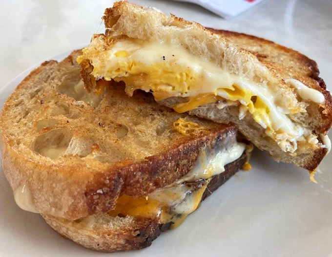 Melted cheese cascades like a waterfall of happiness between perfectly toasted sourdough slices.
