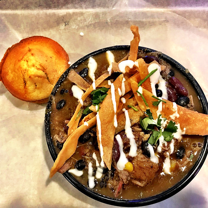 A bowl of brisket chili that's like a warm hug for your taste buds. Those tortilla strips add the perfect crunch.