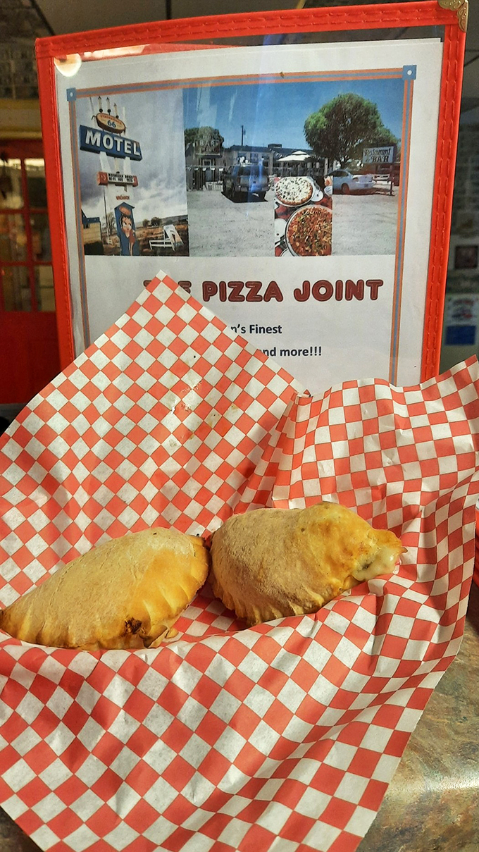 Golden-brown pockets of joy served on classic checkered paper - these calzones are what comfort food dreams are made of. 