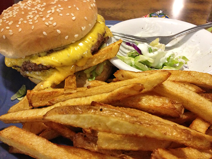 This burger's so cheesy, it could headline in Vegas. With those crispy fries, it's a dynamic duo of deliciousness.