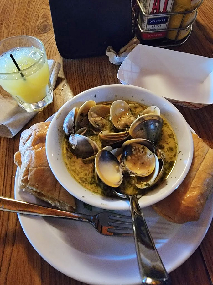 These aren't just clams, they're tiny flavor bombs waiting to explode. Paired with that crusty bread? Pure culinary dynamite! Photo credit: Sherri Vanoskey