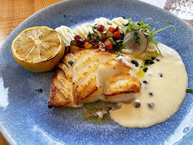 Pan-seared cod in lemon butter sauce that's so perfectly cooked, it practically glows on the plate.