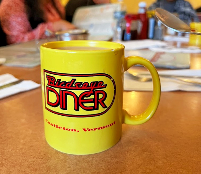 The Birdseye's signature mug: a beacon of hope in a sleepy world. It's not just coffee, it's liquid motivation!