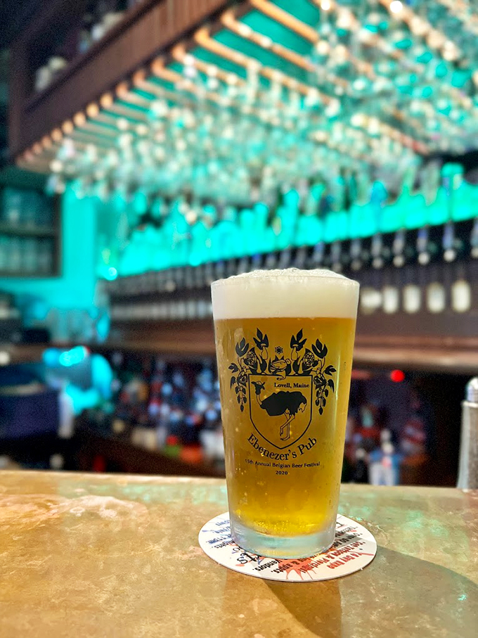 A perfectly poured craft beer catches the light, its golden hue promising refreshment beneath a pillowy head. Photo credit: Benjamin Moore