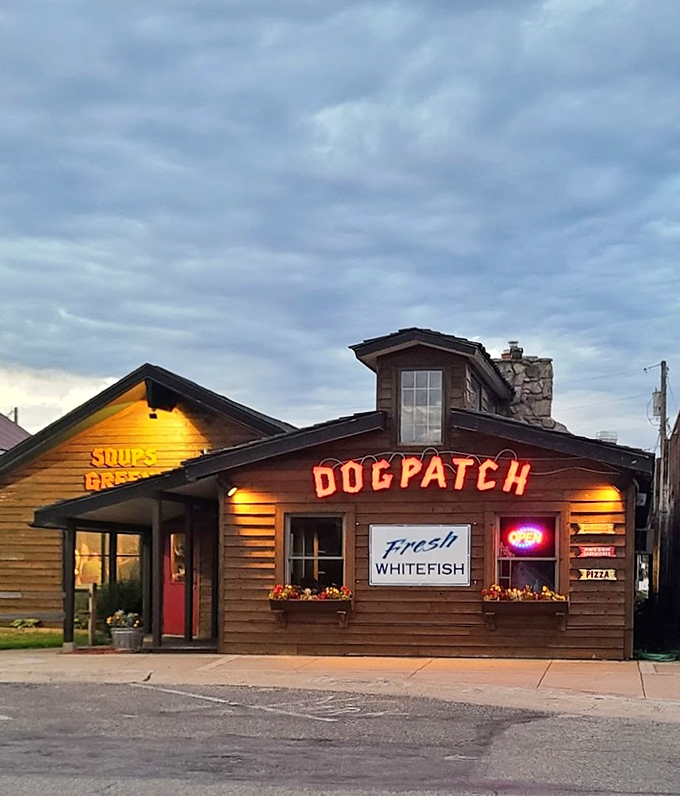 Warm lights welcome hungry travelers as dusk settles, promising fresh whitefish and homestyle comfort under the northern sky.