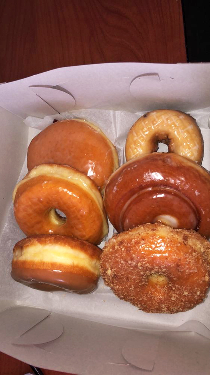 A box of glazed perfection that makes Monday mornings bearable and weekend brunches memorable.