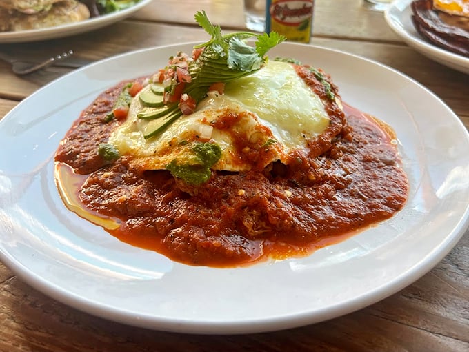 Huevos Rancheros getting the royal treatment with perfectly fanned avocado and a sauce that means business. Photo credit: The AZ Trav