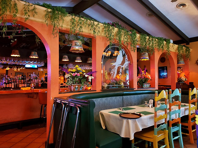 Colorful chairs and hanging plants create the perfect backdrop for making memories over mole sauce. 