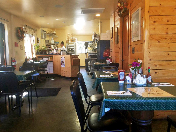 Where pine walls meet checkerboard curtains, creating the perfect small-town diner atmosphere we all crave.