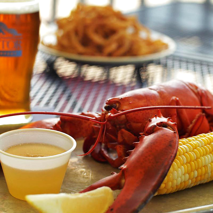 The classic Maine lobster dinner in all its glory: Sweet corn, drawn butter, and a red crustacean ready for its close-up. Photo credit: Archer's on the Pier