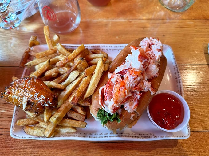 A classic lobster roll that doesn't mess around &ndash; just pure, sweet meat in a perfectly toasted bun with crispy fries. Photo credit: ncbasspraise - Pat Weist