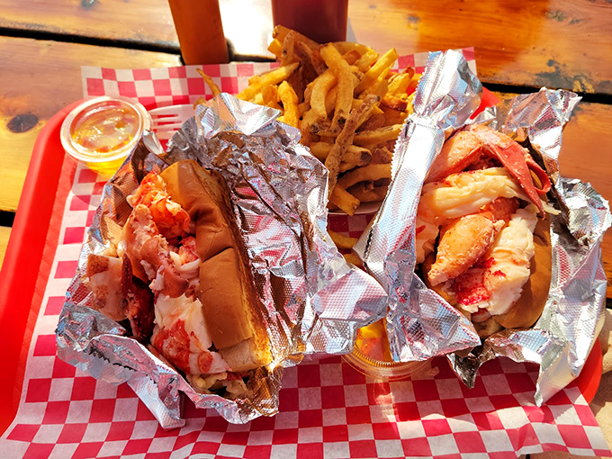 Two lobster rolls that prove sometimes the best things in life come wrapped in foil and served with fries.