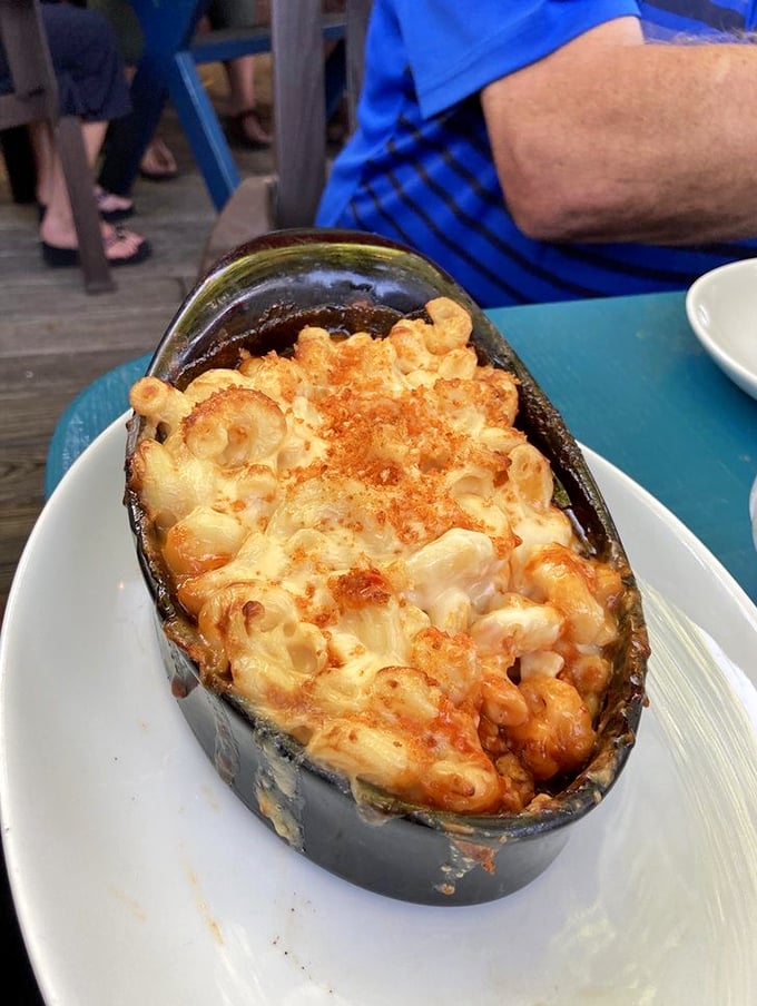 Bubbling mac and cheese served in a boat of pure comfort, topped with a golden-brown crust that begs to be broken.