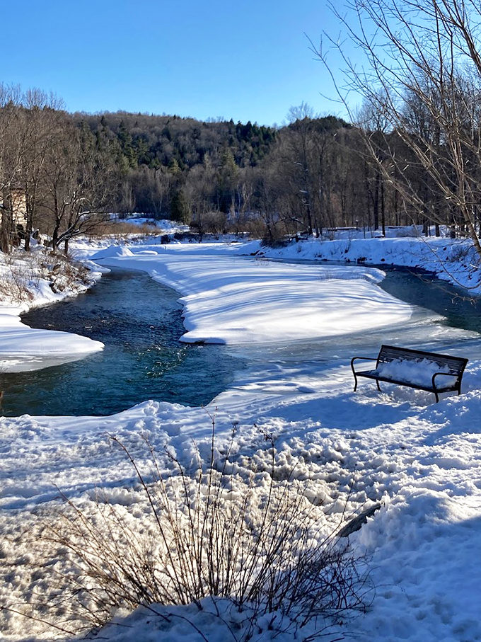 Brrr-illiant! The Mad River in winter is nature's own ice sculpture, with the bridge playing the role of proud art gallery curator.