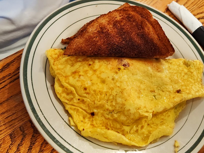 This omelet is so perfectly folded, it could teach origami classes. Paired with that golden toast, it's the breakfast equivalent of a power suit &ndash; ready to take on the day.