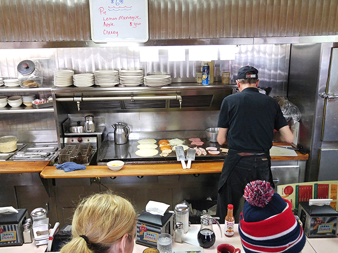 Sizzle, flip, serve, repeat! This open kitchen is like a mouthwatering theater where the stars are eggs and the soundtrack is bacon.