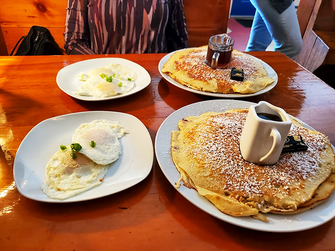 A breakfast duet that hits all the right notes: cloud-like pancakes sharing the spotlight with perfectly sunny eggs.