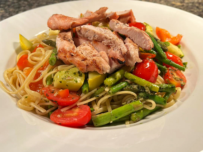 Fresh vegetables and tender chicken transform simple linguine into an artist's palette of colors and flavors.