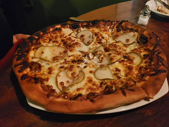 A pizza that whispers "oui oui" &ndash; perfectly charred crust topped with delicate pears and melted cheese. French-Italian diplomacy at its finest.