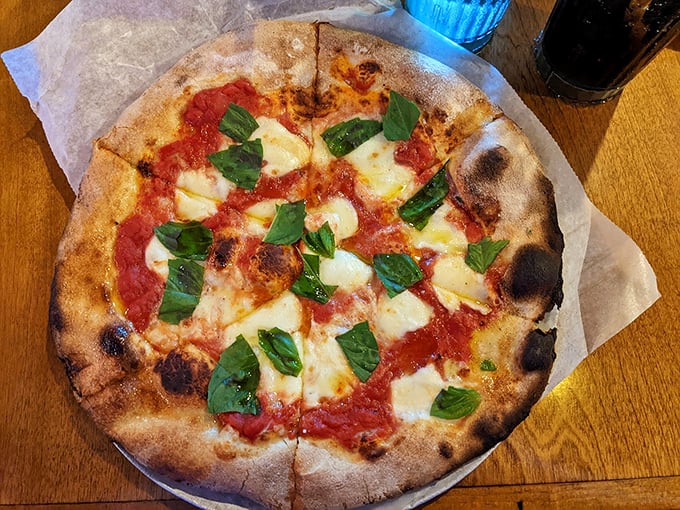 A classic Margherita pizza that proves sometimes the simplest combinations create the most beautiful symphonies of flavor. Photo credit: Brian Michalski